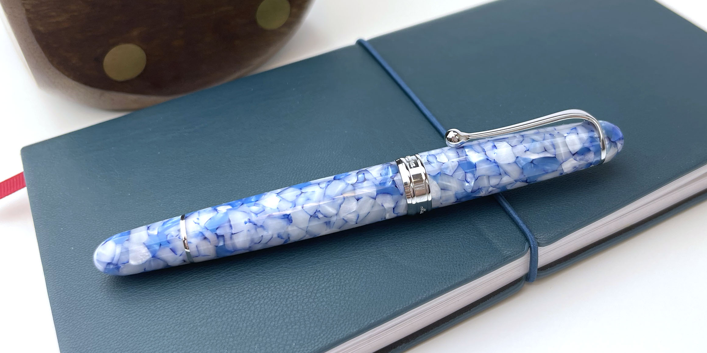 888 matera LE fountain pen capped on notebook - Pen Chalet